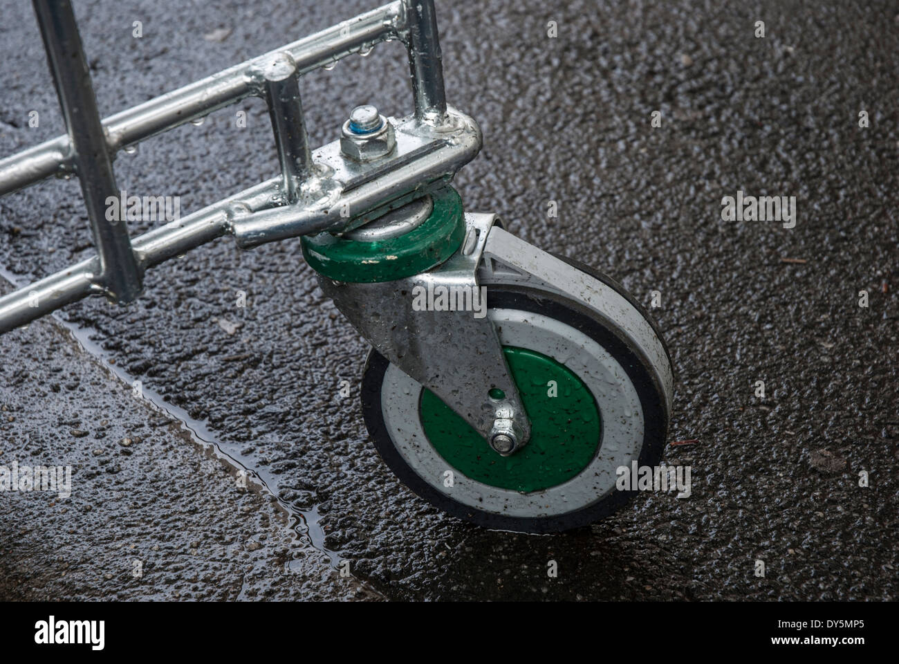 Close up shopping trolley wheel Stock Photo - Alamy