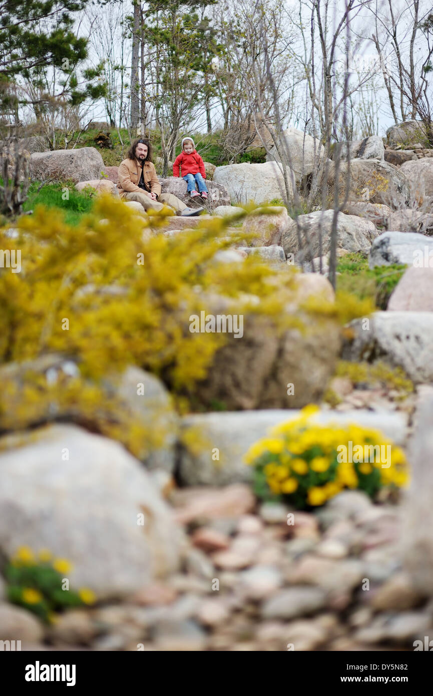 Father and daughter taking a walk in a spring park Stock Photo - Alamy