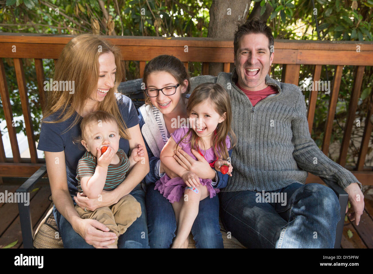Family relaxing on porch hi-res stock photography and images - Alamy