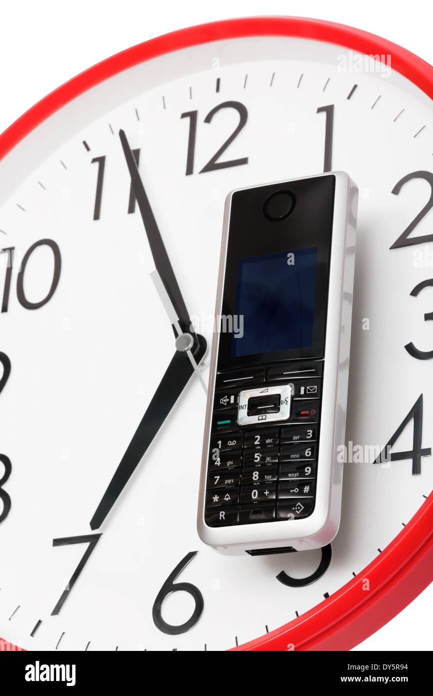 Modern phone on a dial of clock Stock Photo - Alamy