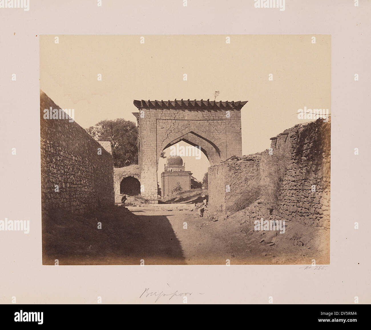 The image depicts the historical fortifications of Beejapoor (also ...