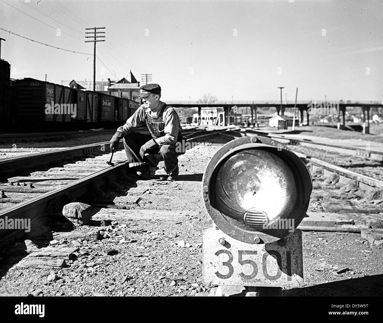 The image shows track maintenance work being carried out by railroad ...