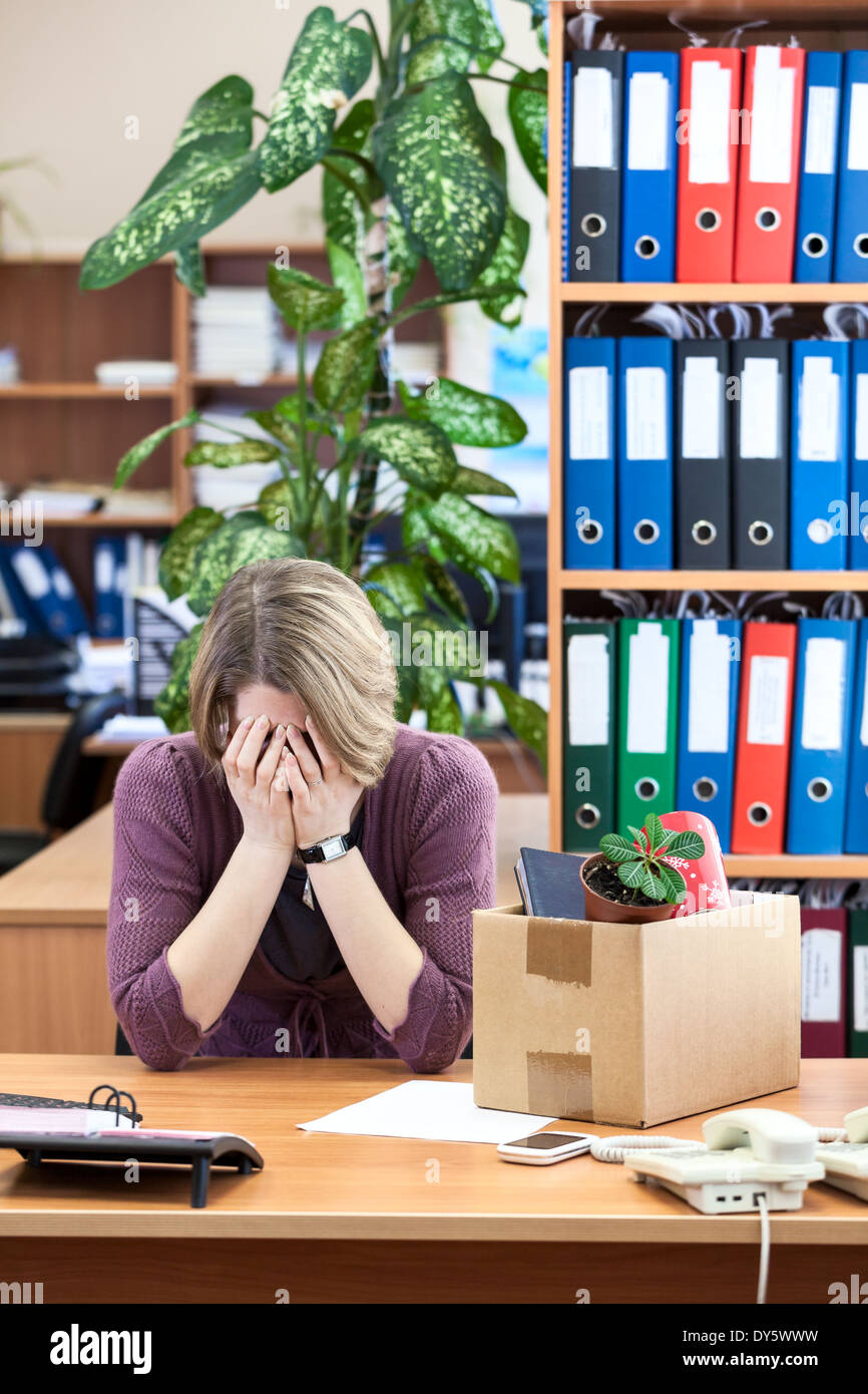 Layoff at work, employee upset with things to take away Stock Photo - Alamy