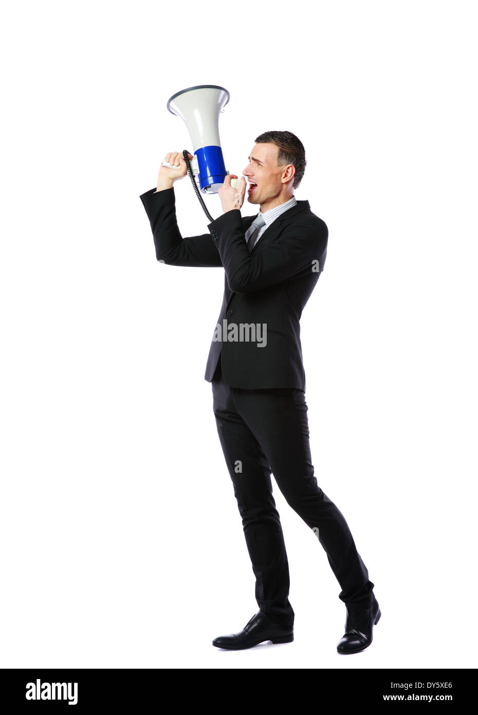 Full length portrait of businessman yelling through megaphone isolated ...