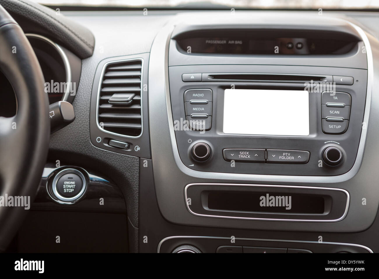 Panel of a modern car with push-button start and a white screen ...