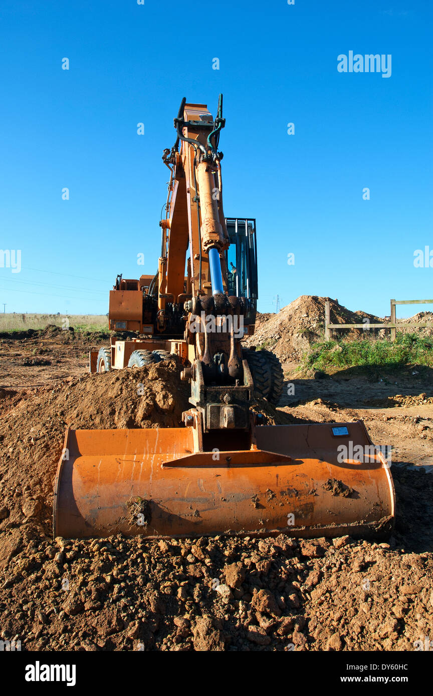 an earth mover on a new construction site Stock Photo - Alamy