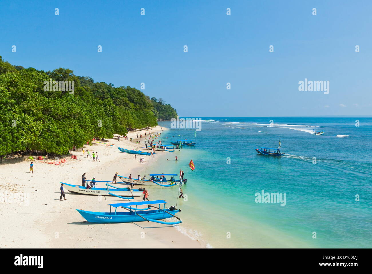 Outrigger boats on beautiful white sand beach in the national park on ...