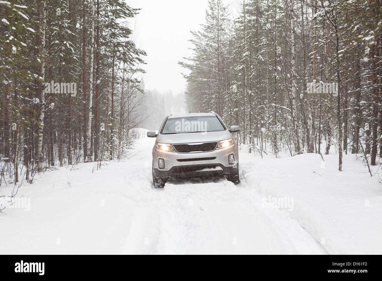 Offroad car riding on snowy road, front view Stock Photo - Alamy