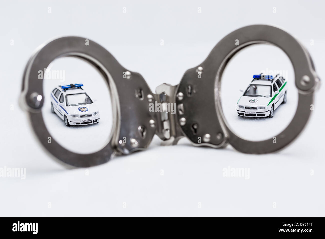 Shackles with models of police and city police car on white background ...