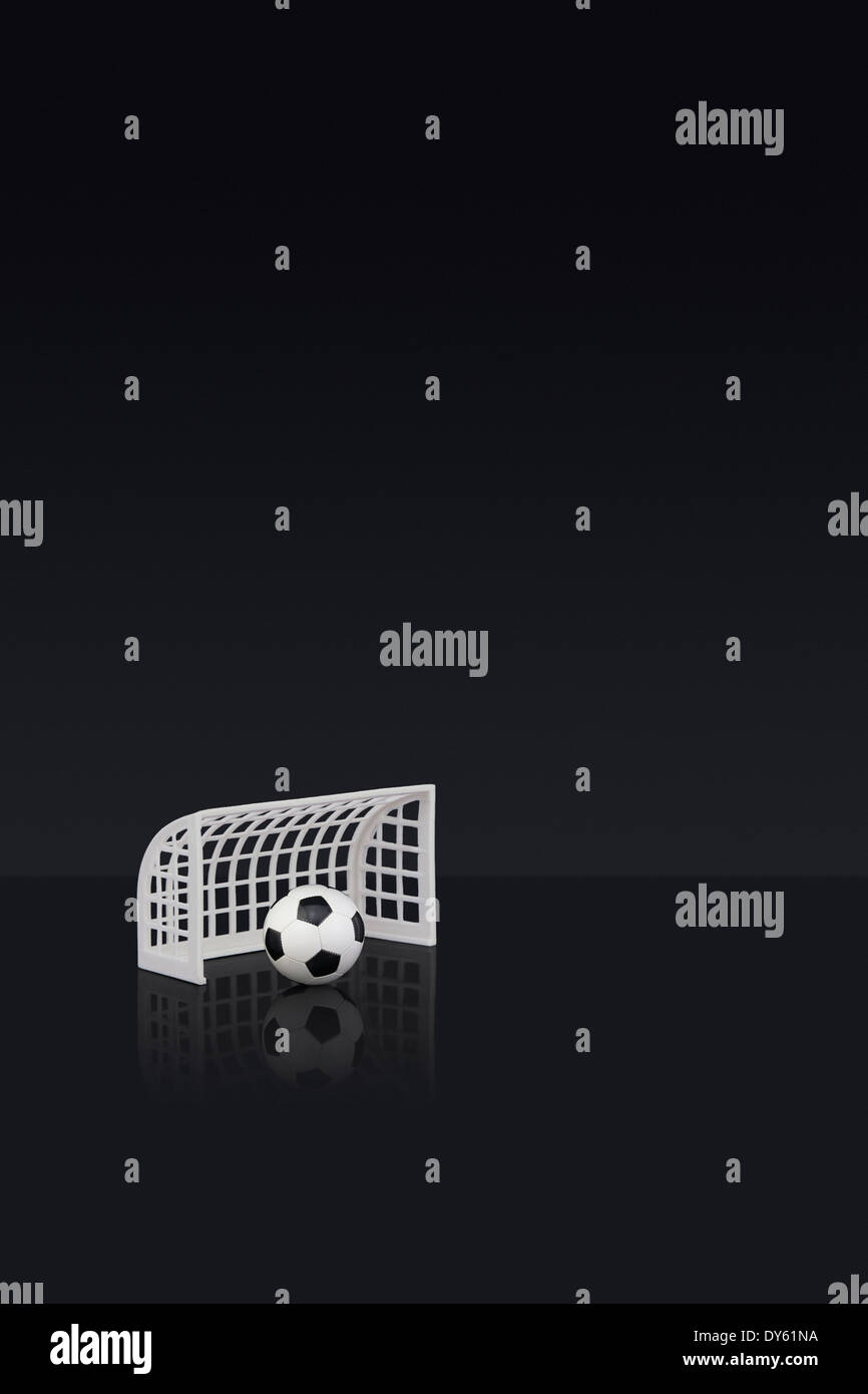 White plastic table top football goal with black & white leather ...