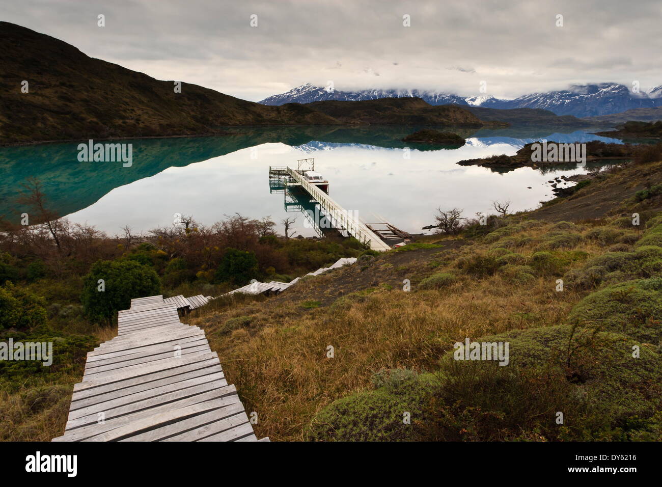 Steps to boatdock and reflections in Lago Pehoe, Torres del Paine ...