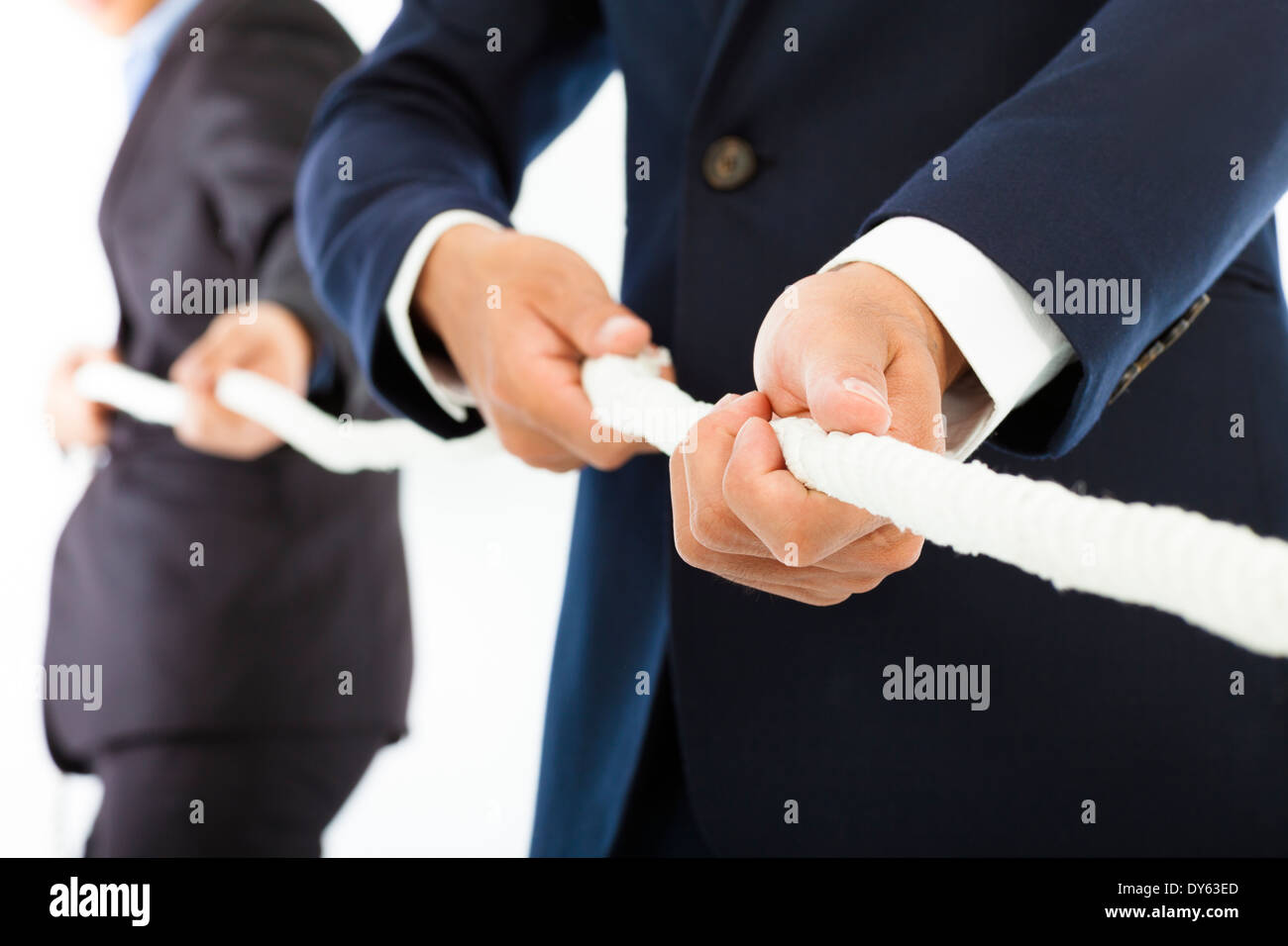 Two businessman work together and playing tug of war over white Stock ...