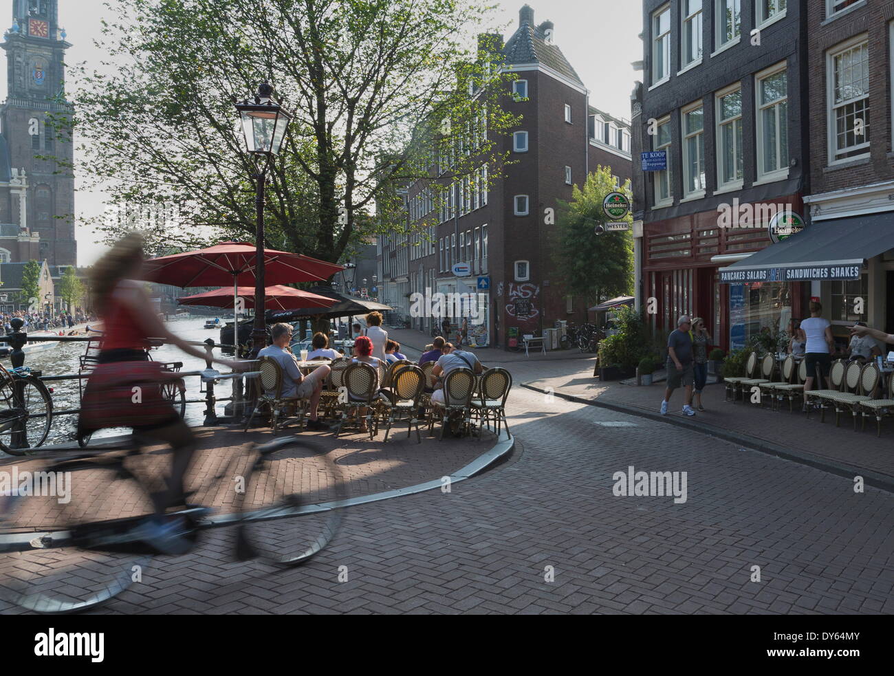 Cyclist and pavement cafe, Amsterdam, The Netherlands, Europe Stock ...