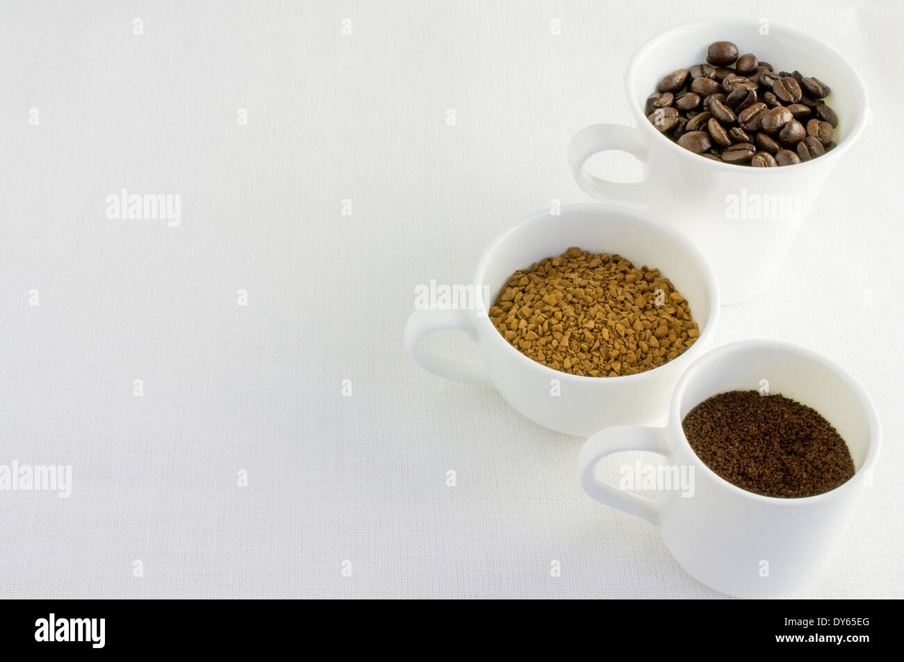 Coffee: instant, beans, ground. Each species in different cups. For ...