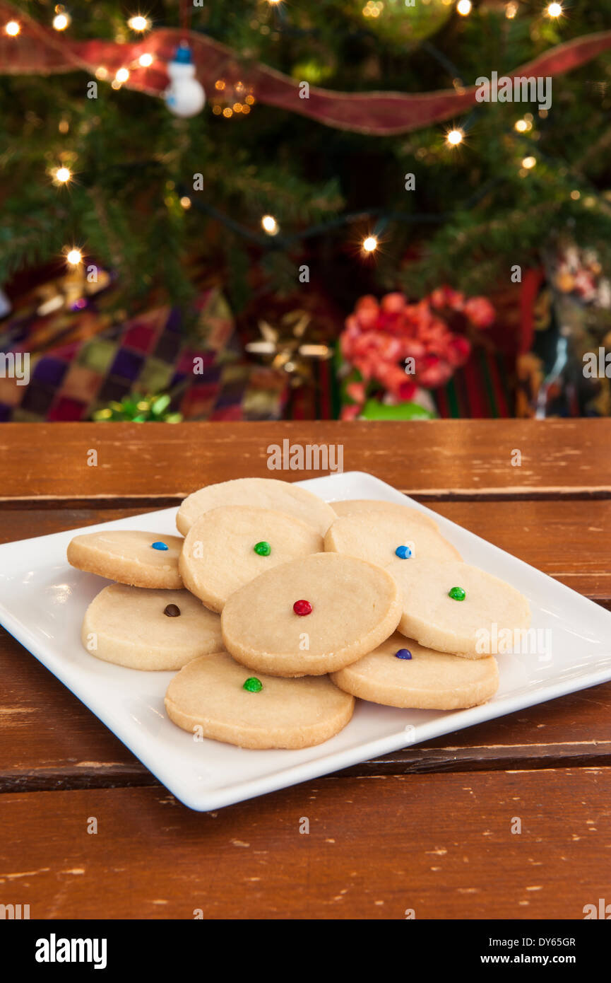 Plate of shortbread cookies in front of the Christmas tree Stock Photo ...