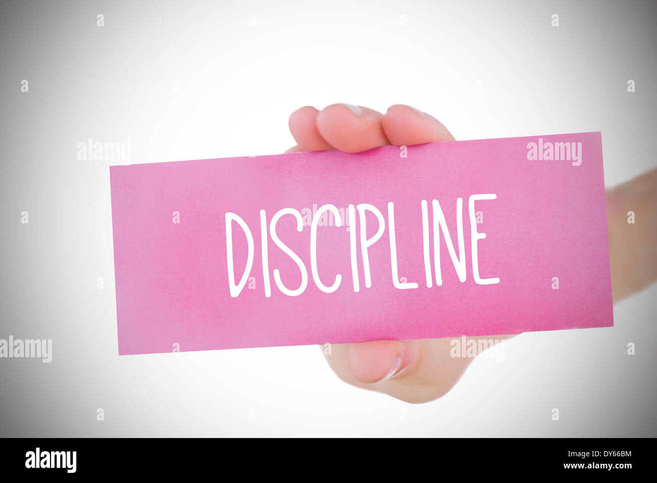 Woman holding pink card saying discipline Stock Photo - Alamy