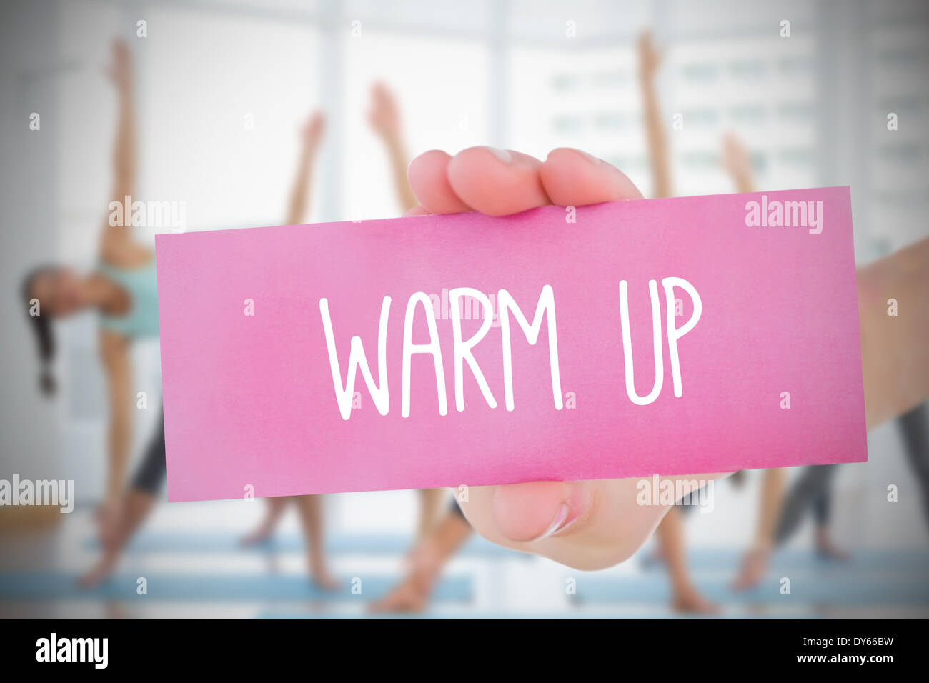 Woman holding pink card saying warm up Stock Photo - Alamy