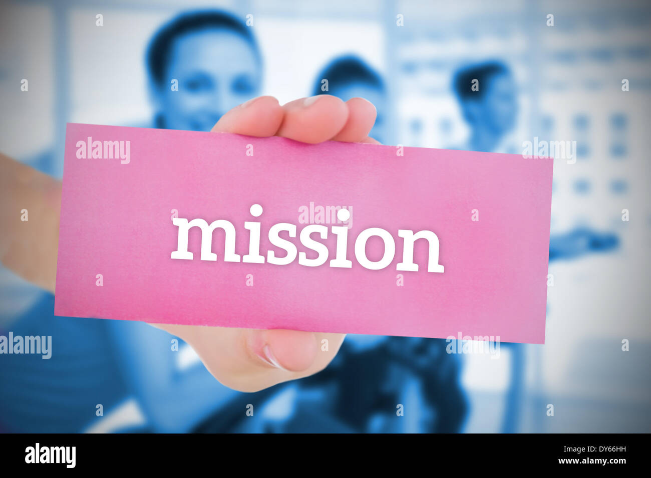 Woman holding pink card saying mission Stock Photo - Alamy
