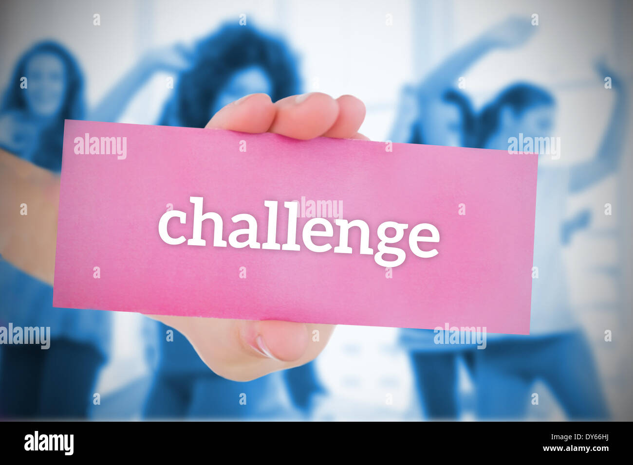 Woman holding pink card saying challenge Stock Photo - Alamy