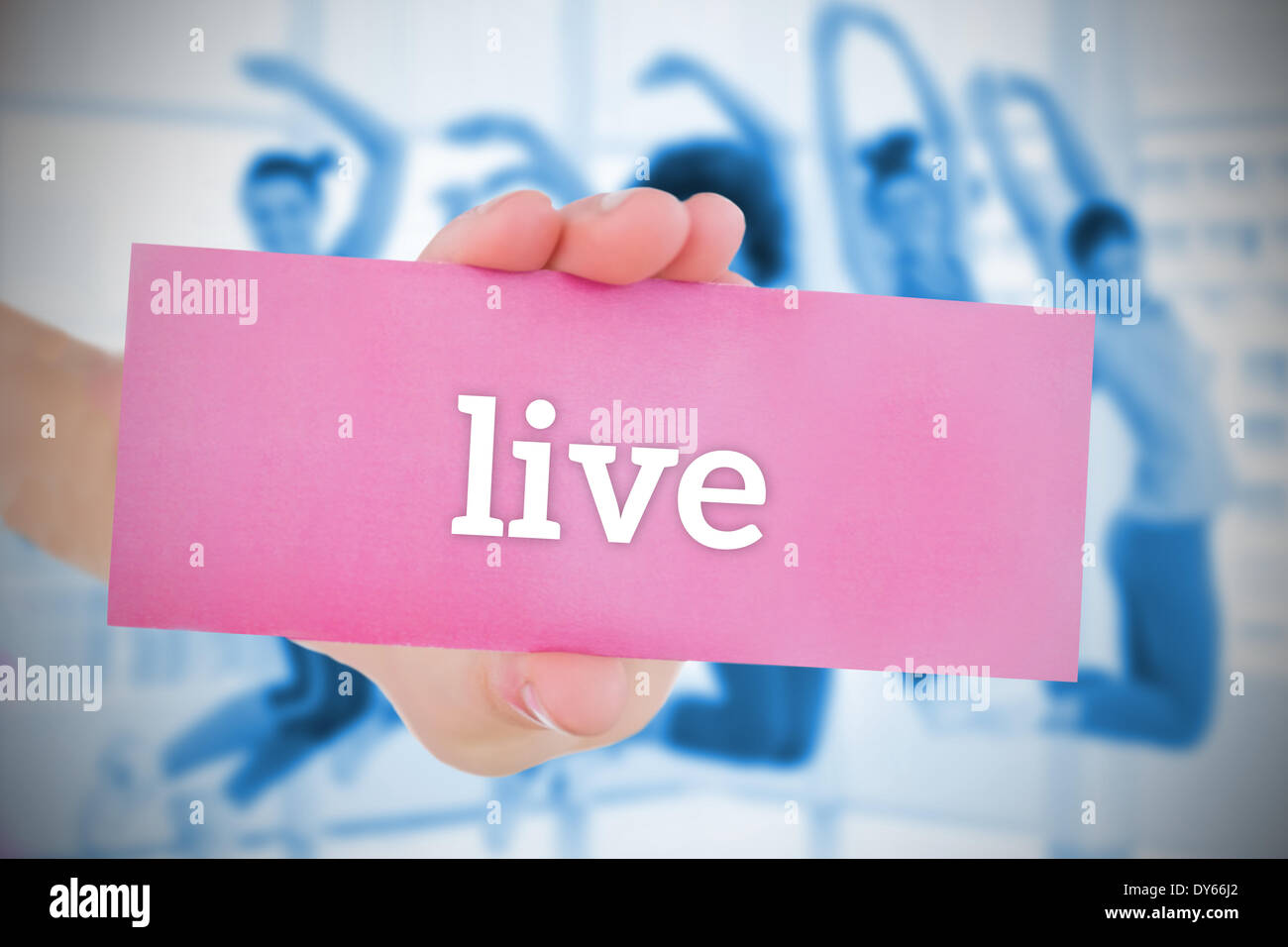 Woman holding pink card saying live Stock Photo - Alamy