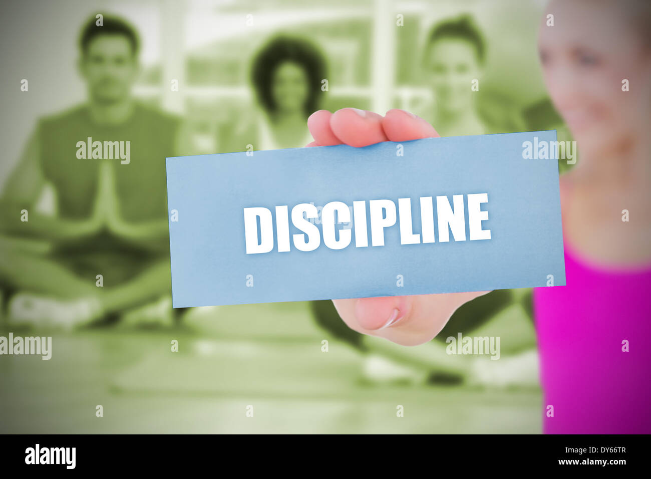 Fit blonde holding card saying discipline Stock Photo - Alamy