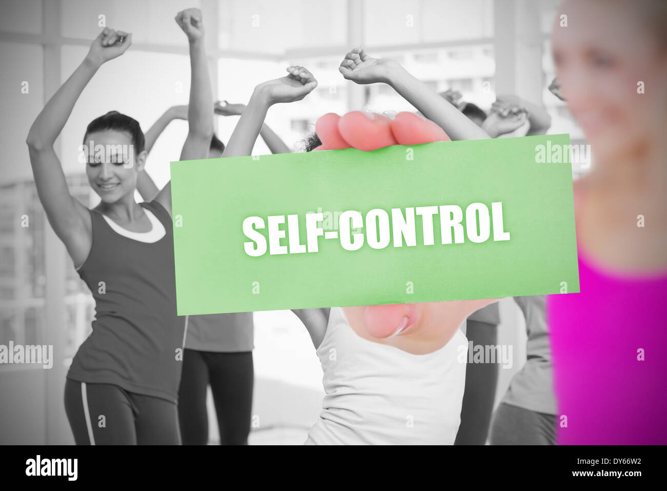 Fit blonde holding card saying self control Stock Photo - Alamy