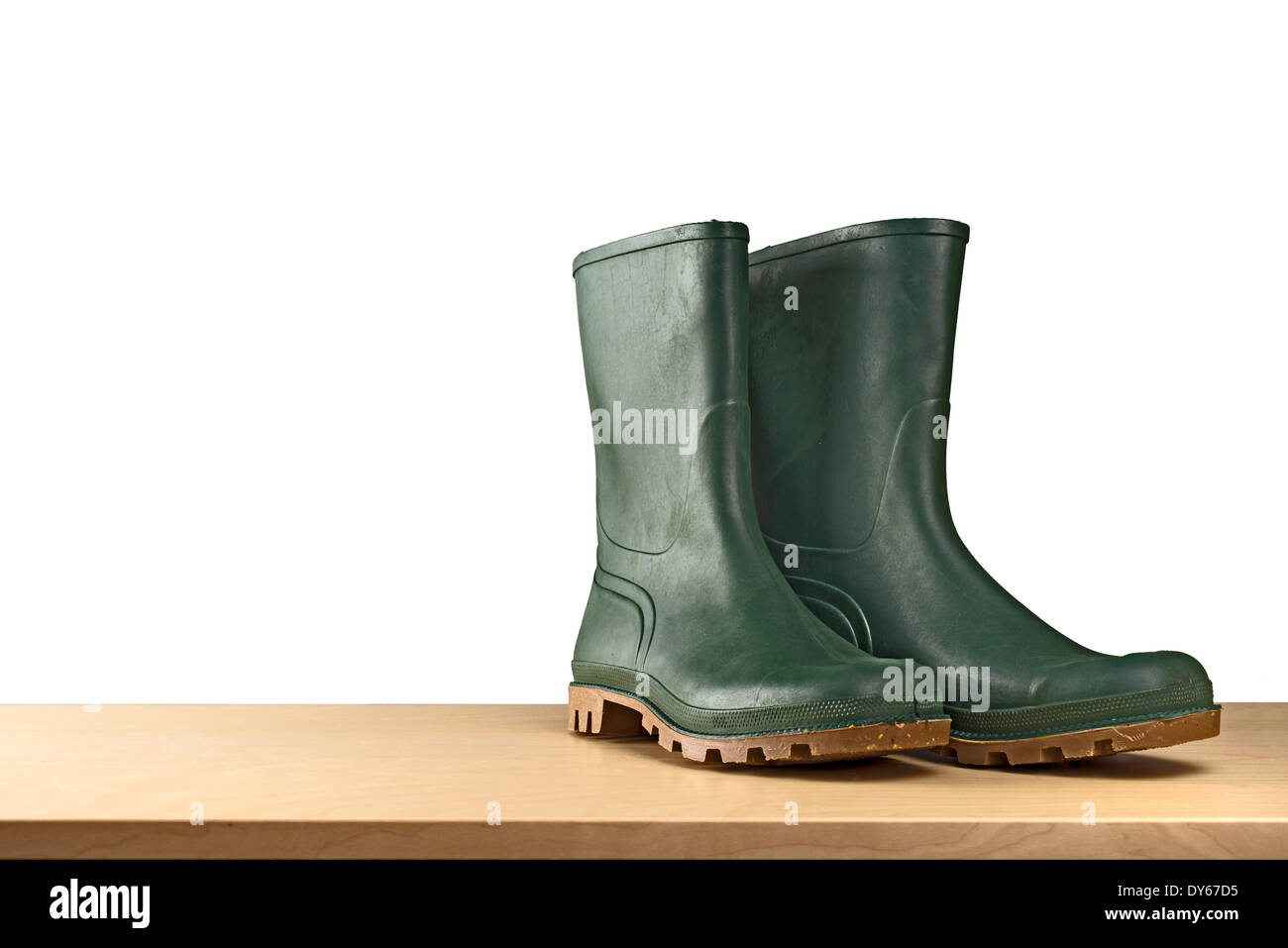 Green rubber boots on white background. Agricultural working boots for ...