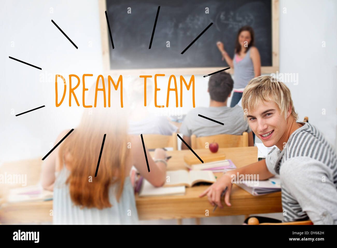 Dream team against students in a classroom Stock Photo - Alamy