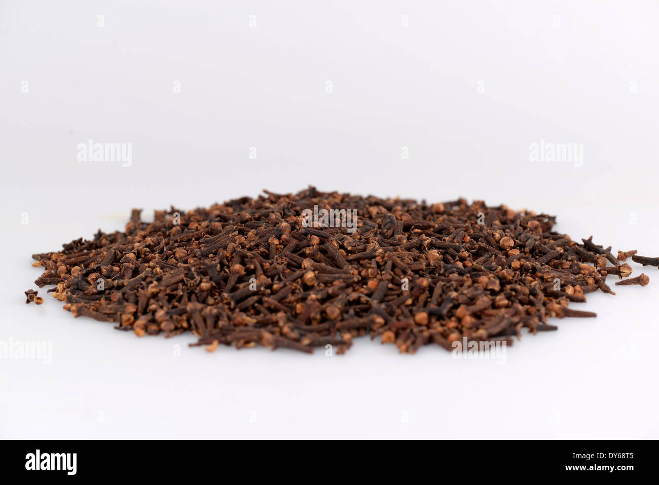 Cloves on white background Stock Photo - Alamy