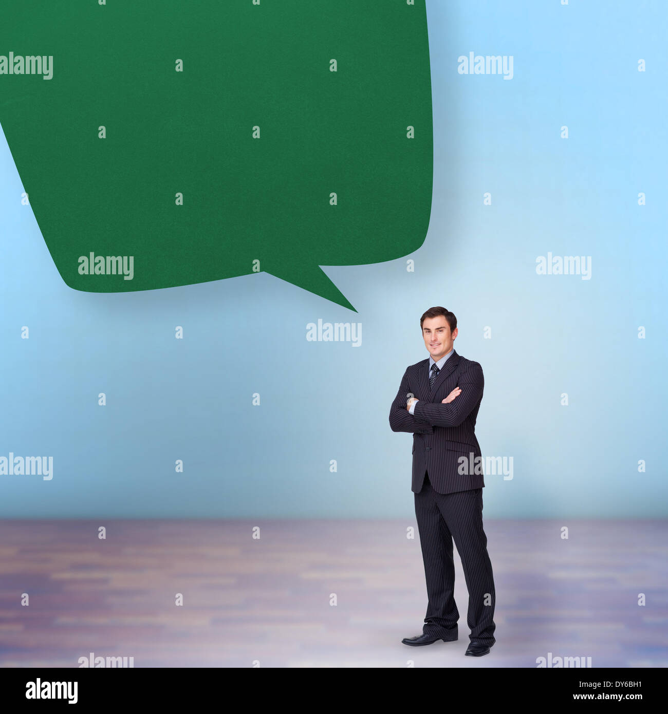 Composite image of young businessman standing cross-armed Stock Photo ...