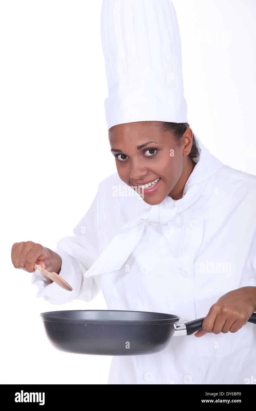 Female chef stirring sauce Stock Photo - Alamy