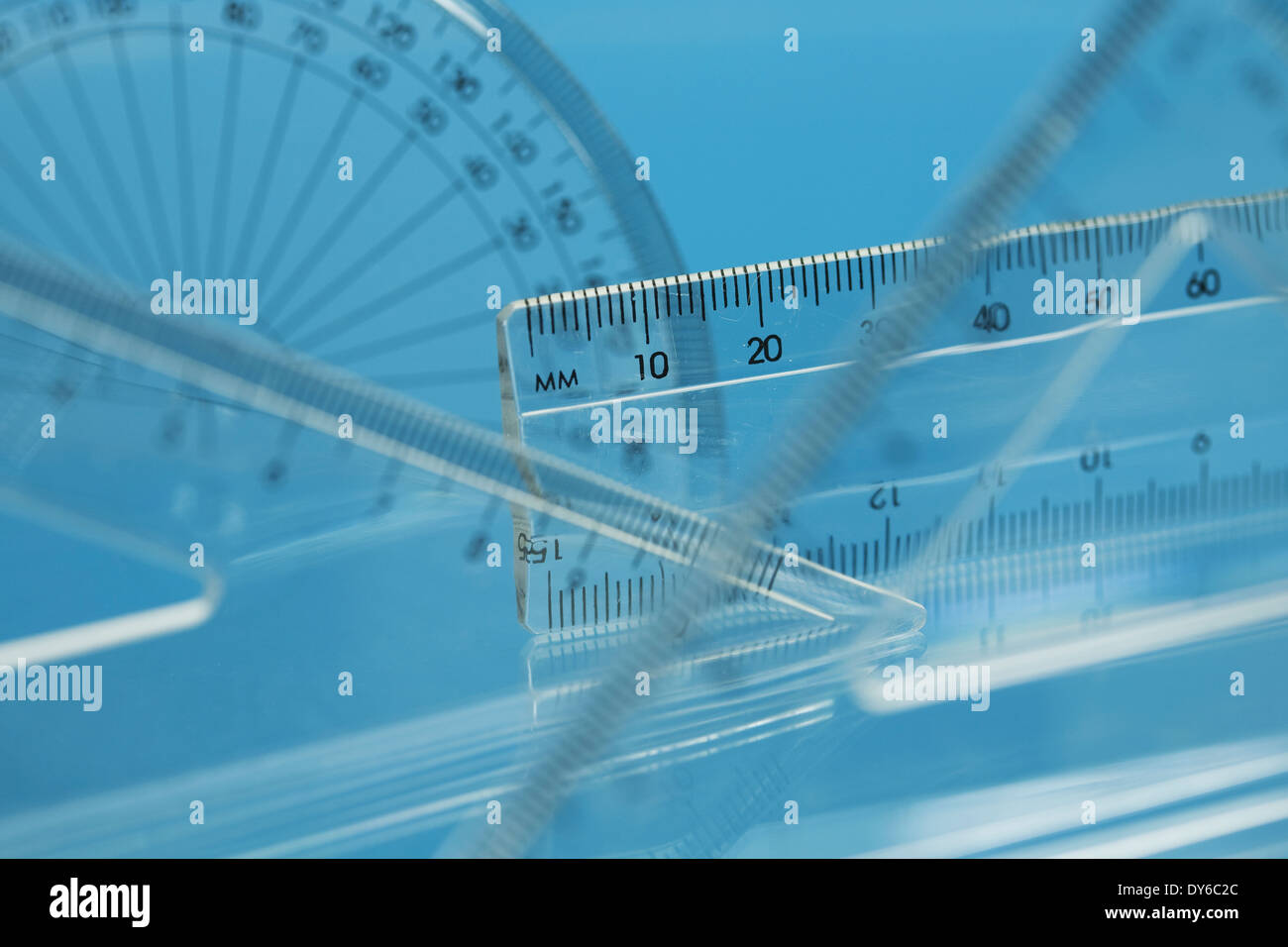 close up of a geometry set showing 45'set square,60"set square and180 ...