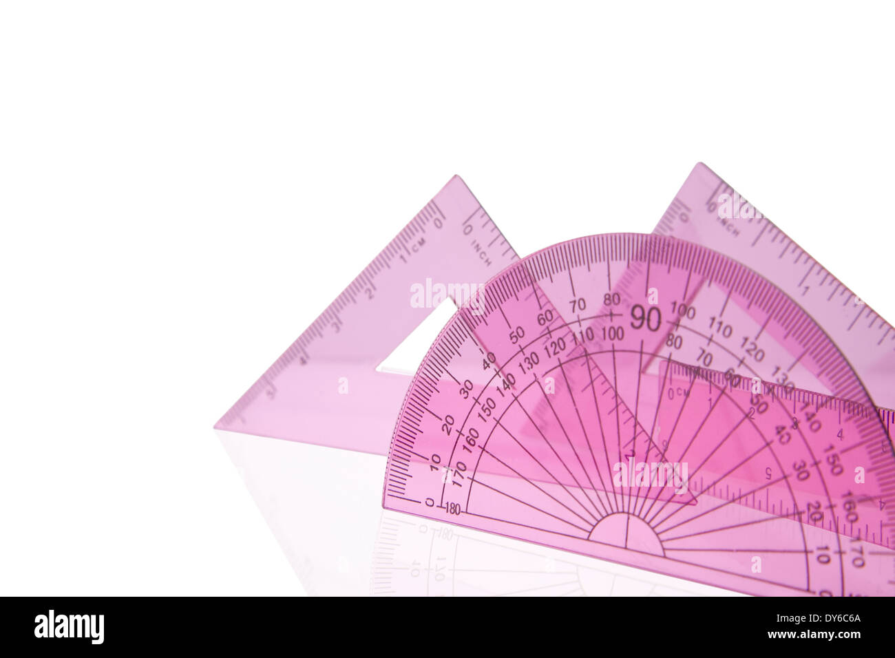 close up of a geometry set showing 45'set square,60"set square and180 ...