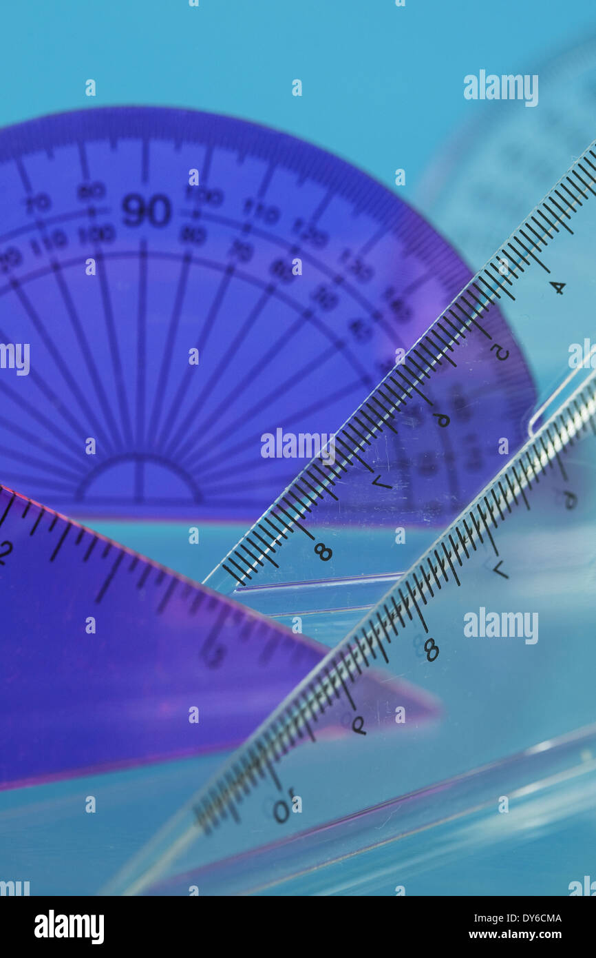 close up of a geometry set showing 45'set square,60"set square and180 ...