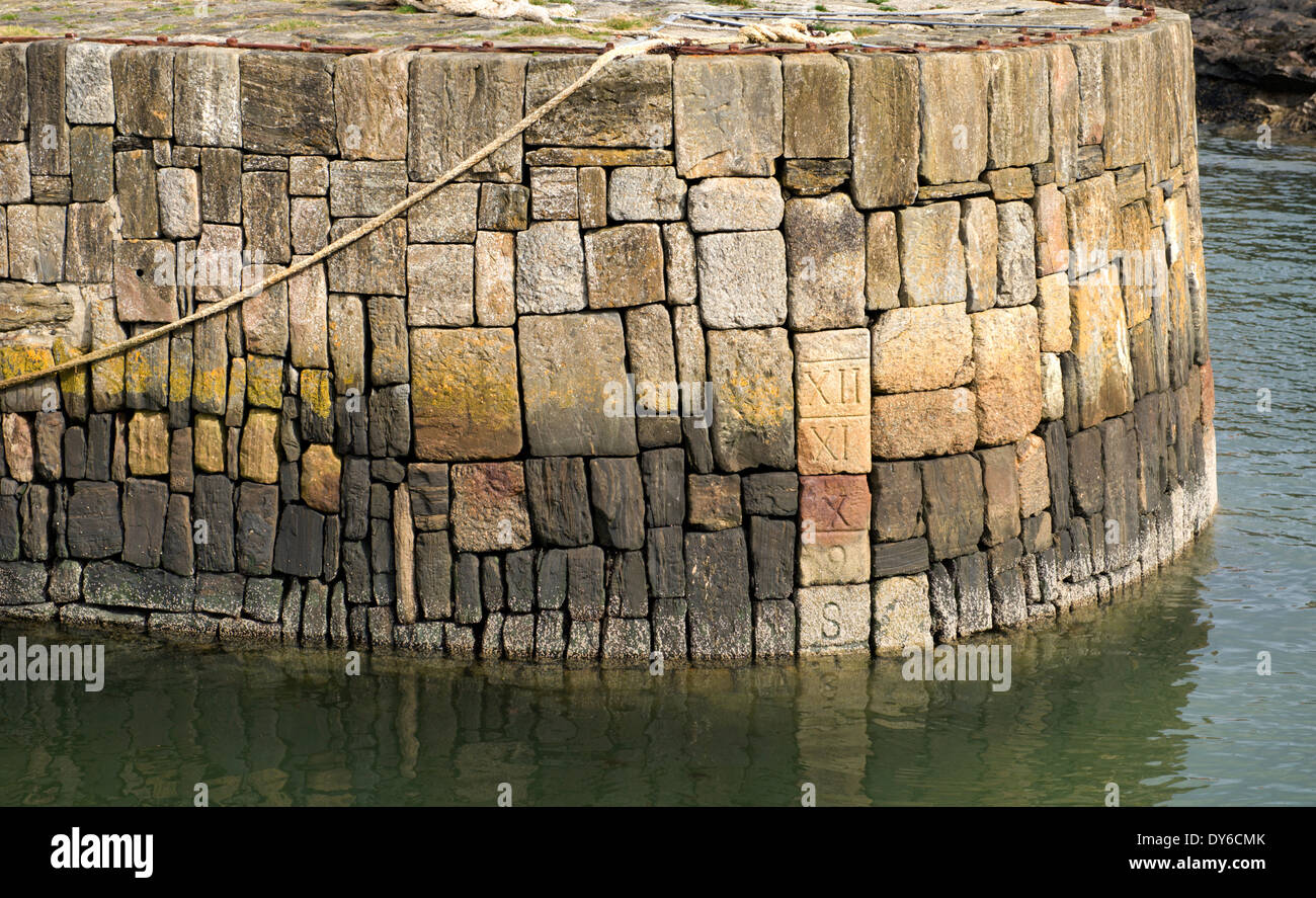 The old harbour wall constructed with stones set vertically at Portsoy ...