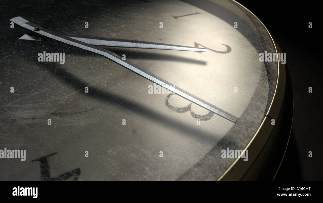 An extreme closeup of a section of a worn antique pocket watch on a ...
