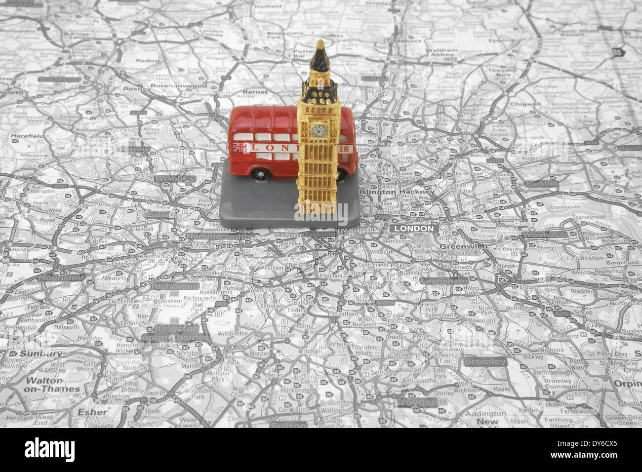 Small Model of a Red Bus and Big Ben on top of a Map of london Stock ...