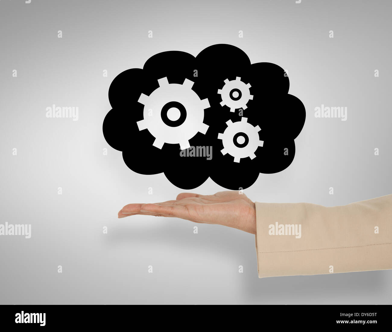 Composite image of female hand presenting cogs and wheels Stock Photo ...