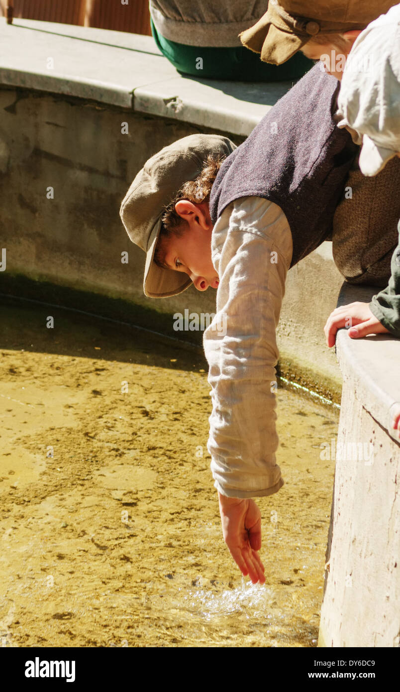 Film child actors on rest near fountain Stock Photo - Alamy