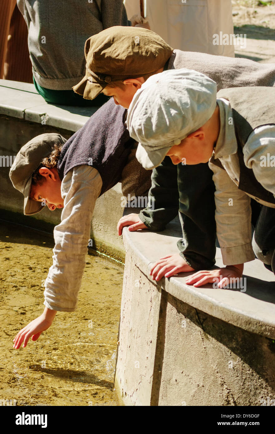 Film child actors on rest near fountain Stock Photo - Alamy