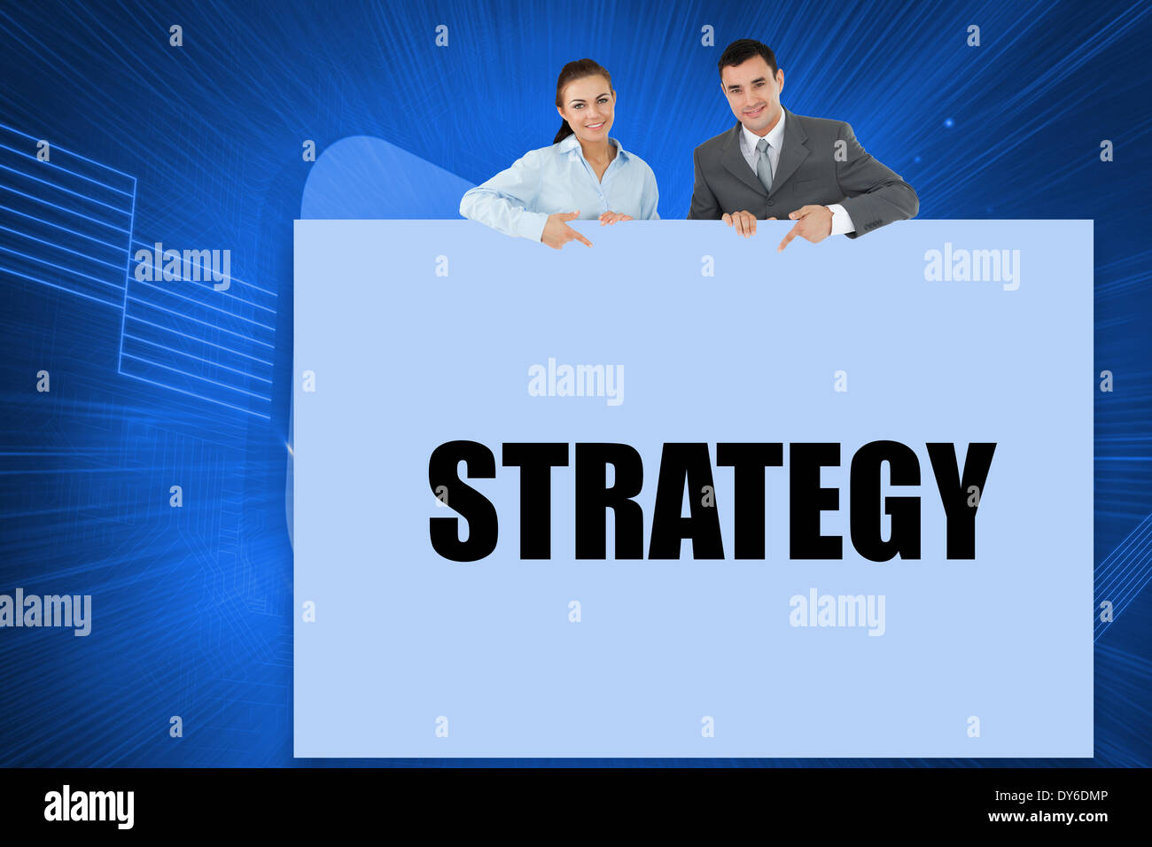 Business partners showing card saying strategy Stock Photo - Alamy