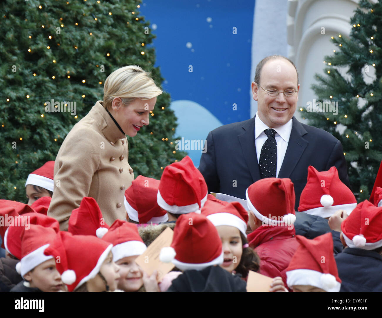 Prince Albert II of Monaco and Princess Charlene of Monaco hand out ...