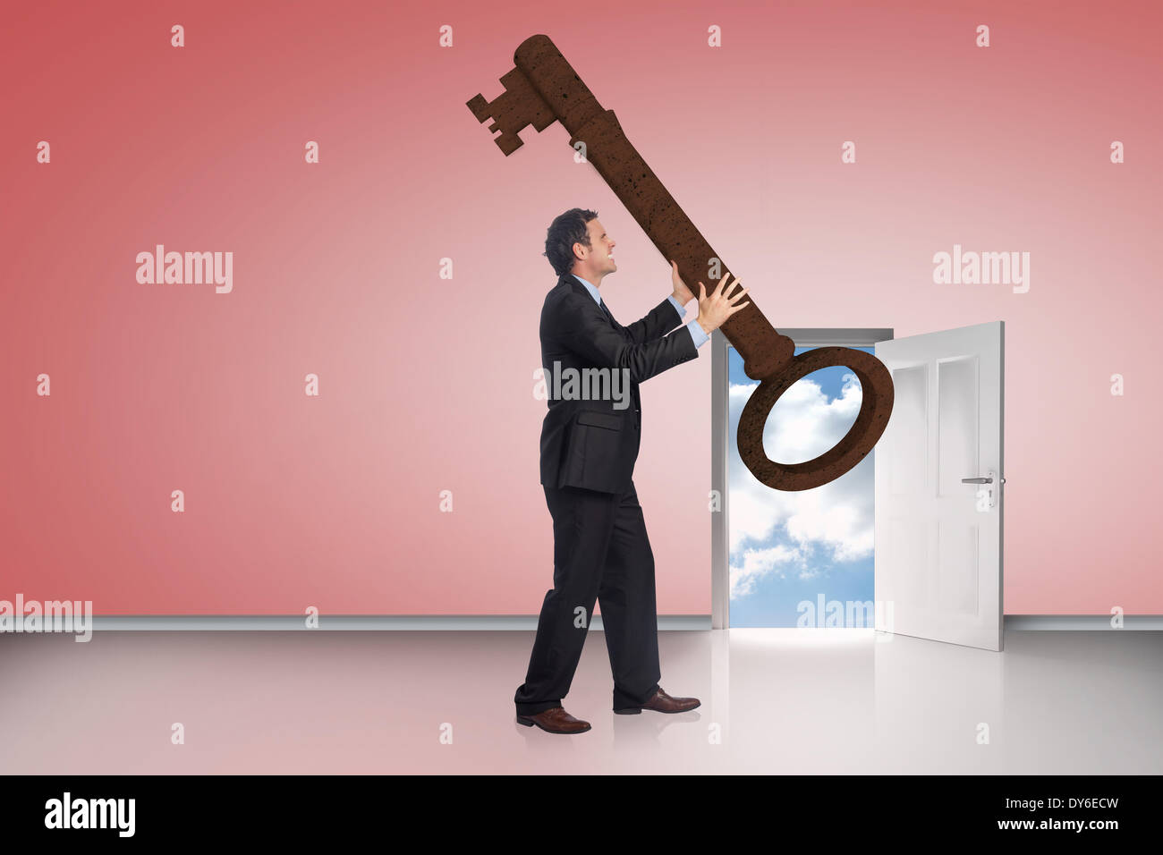 Composite image of stressed businessman carrying large key Stock Photo ...