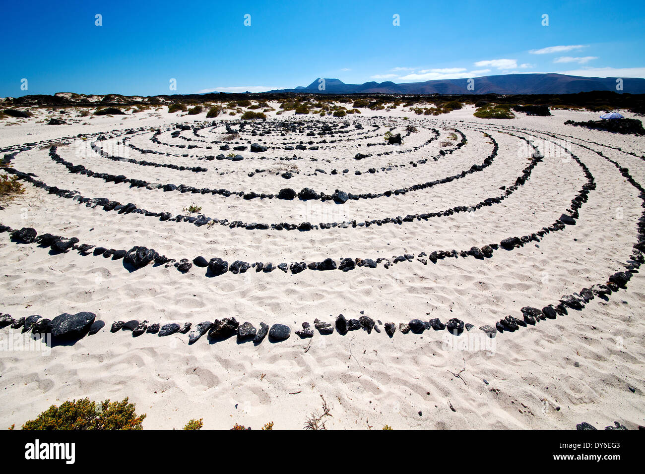 spain hill white beach spiral of black rocks in the lanzarote Stock ...