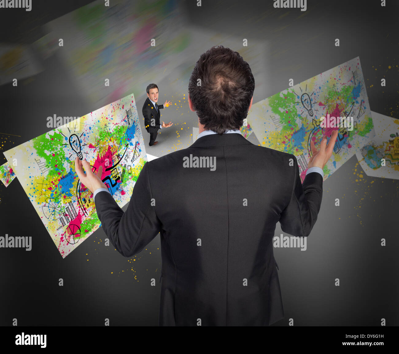 Composite image of gesturing businessman with tiny businessman Stock ...