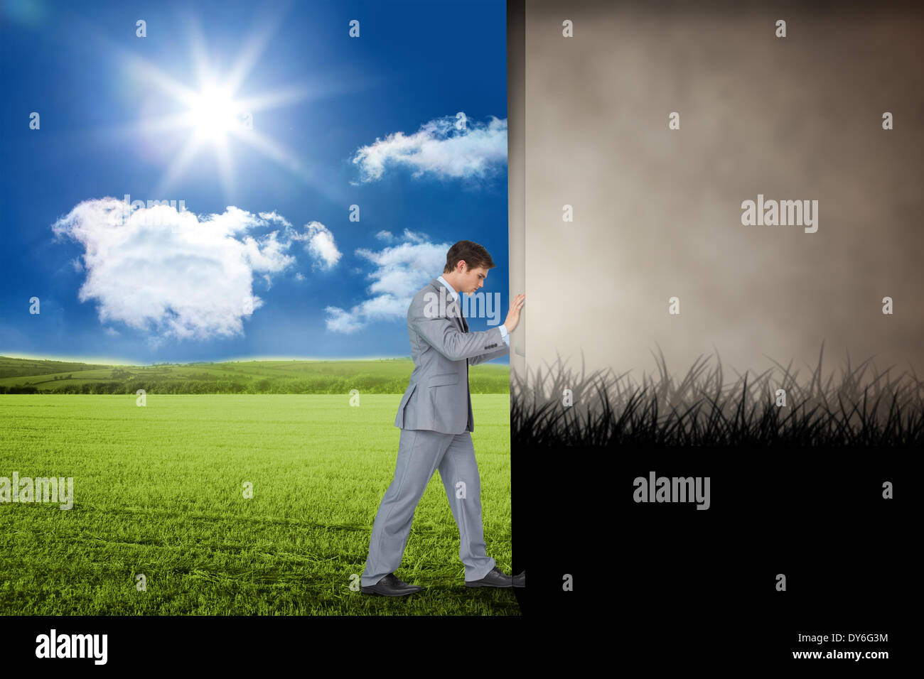 Composite image of businessman pushing away scene Stock Photo - Alamy