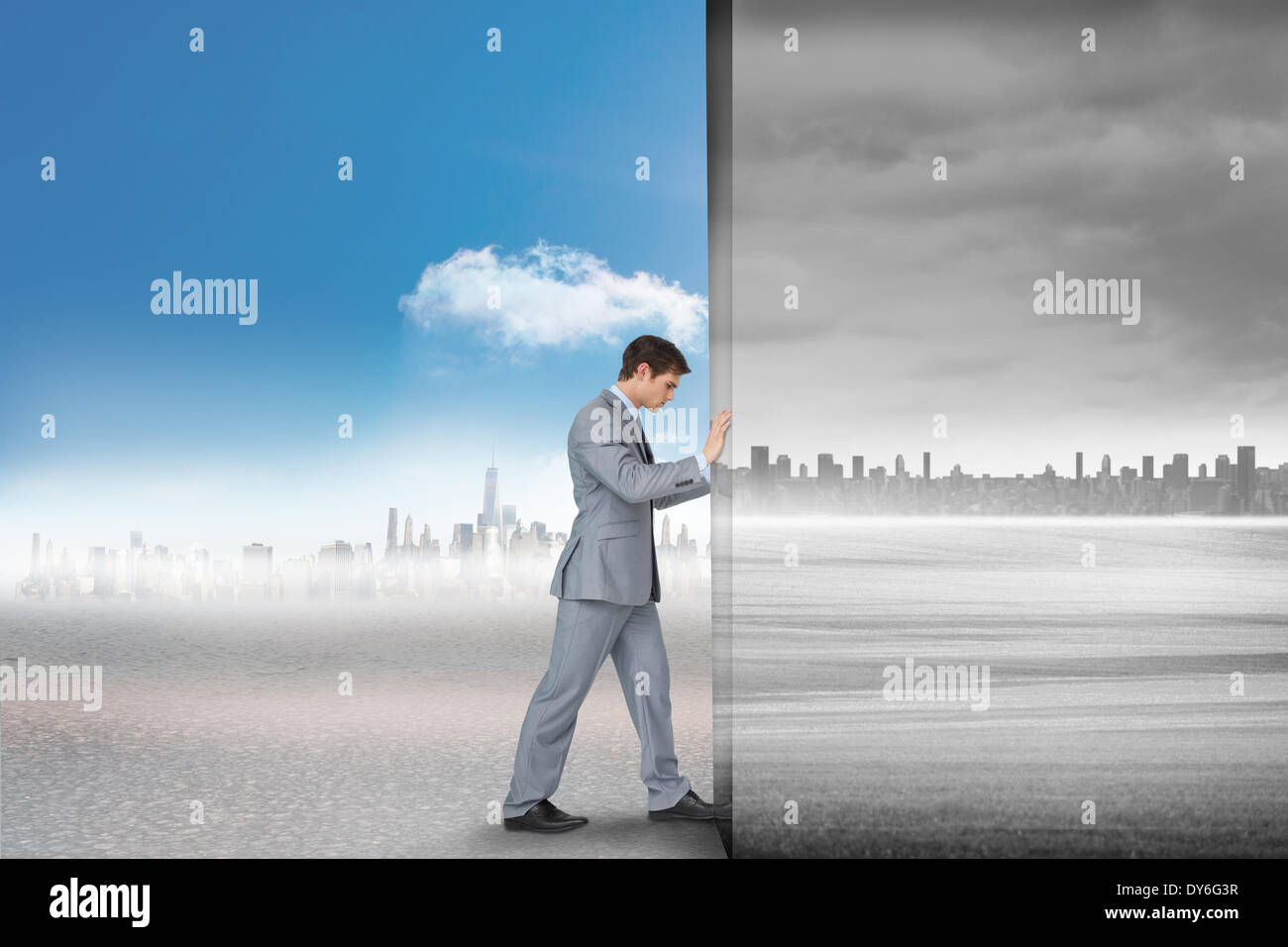 Composite image of businessman pushing away scene Stock Photo - Alamy