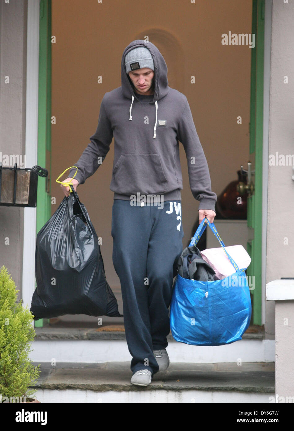 Adam Horsely helps the removal men packing up Imogen Thomas belongings ...
