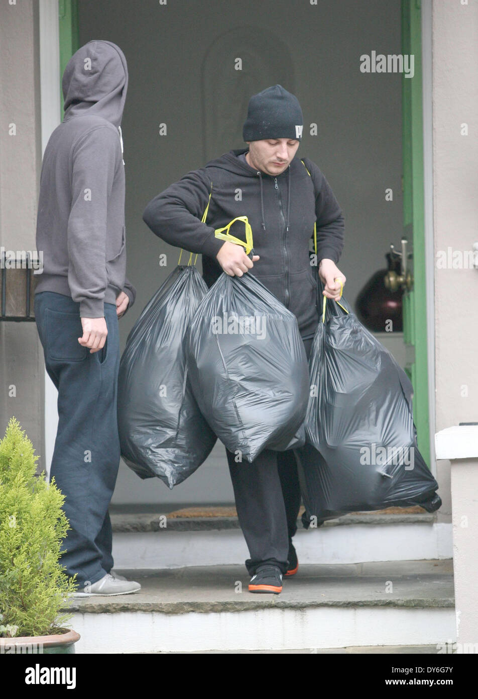 Adam Horsely helps the removal men packing up Imogen Thomas belongings ...