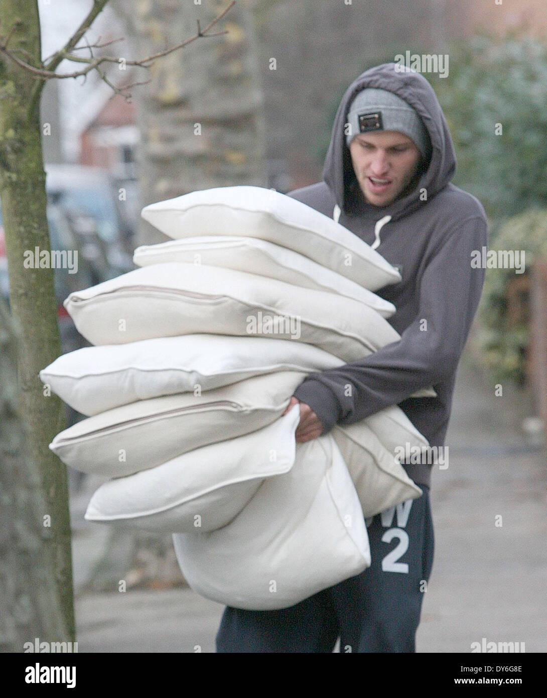 Adam Horsely helps the removal men packing up Imogen Thomas belongings ...